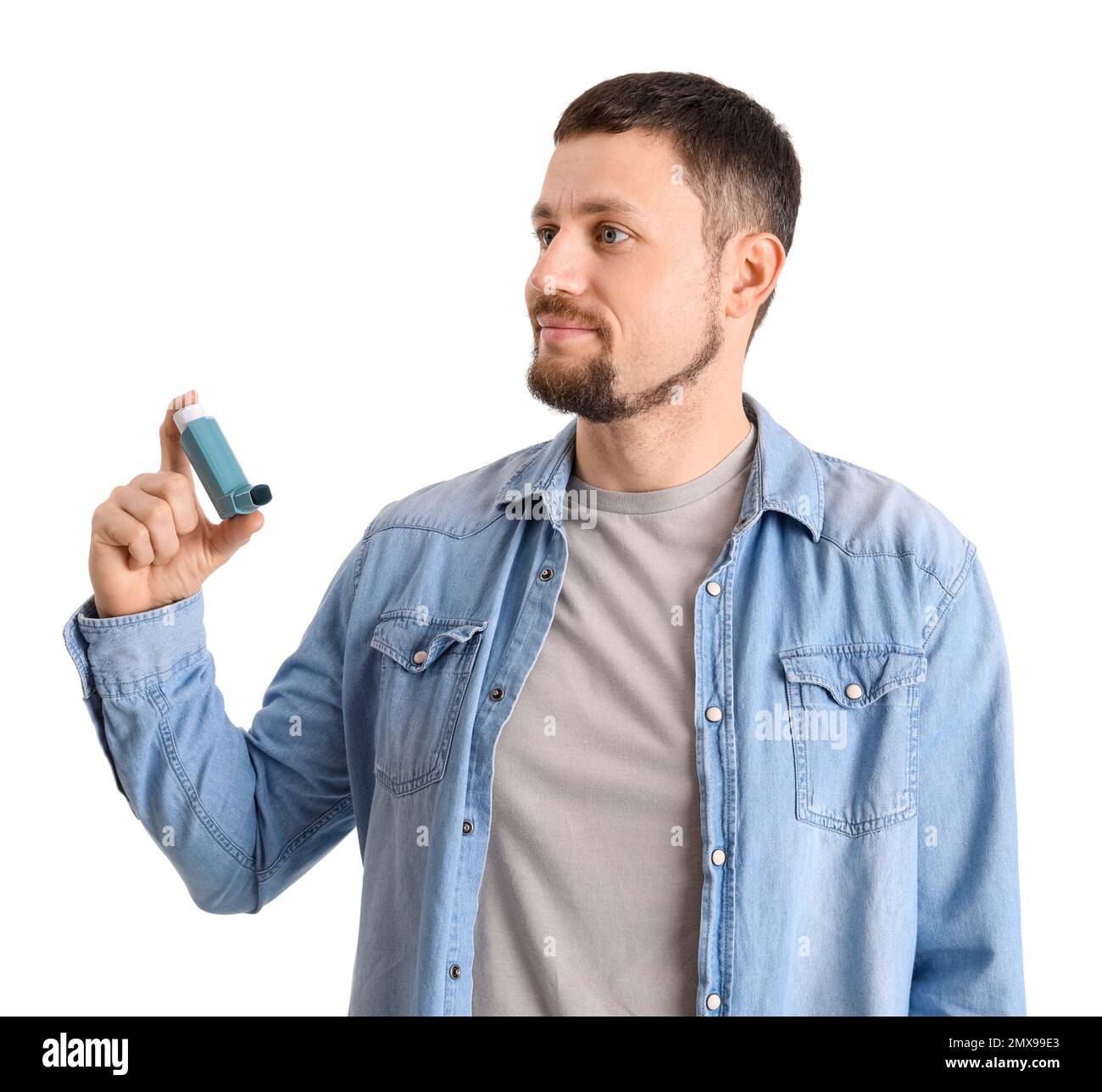 Man with inhaler on white background Stock Photo - Alamy