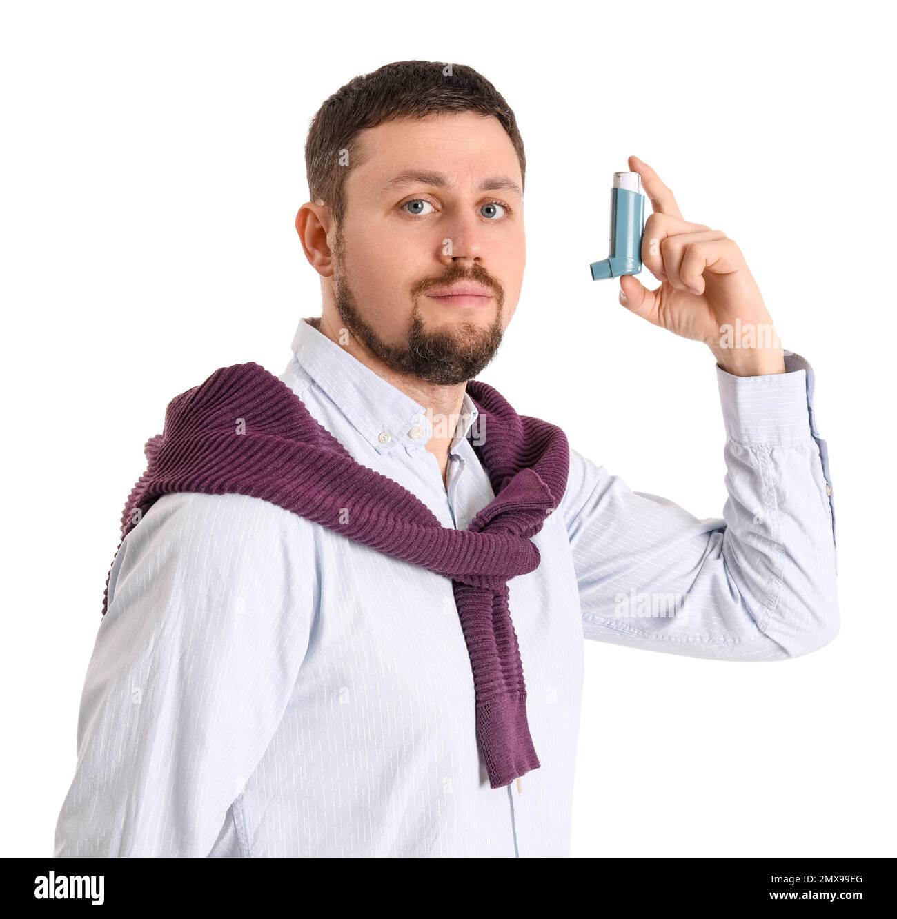 Man with inhaler on white background Stock Photo - Alamy
