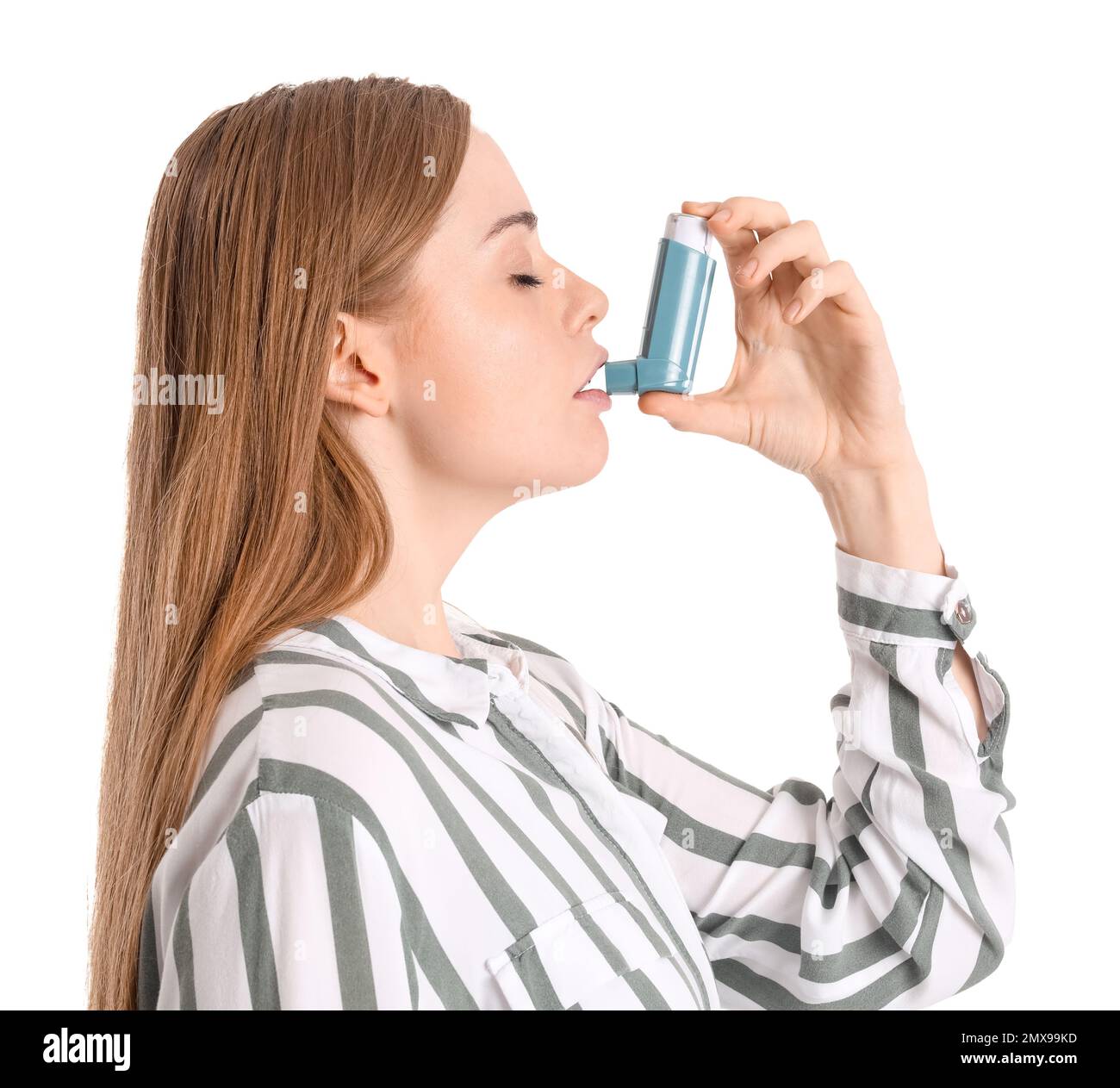 Young woman with inhaler on white background Stock Photo - Alamy