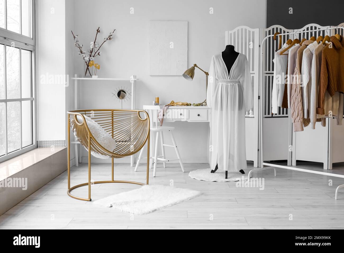 Interior of fashion designer's studio with mannequin, workplace and ...