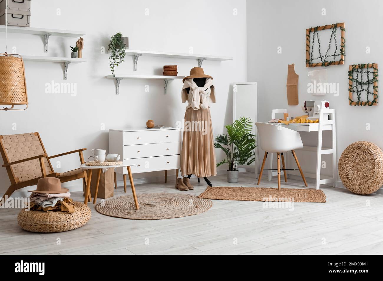 Interior of fashion designer's studio with mannequin, workplace and ...