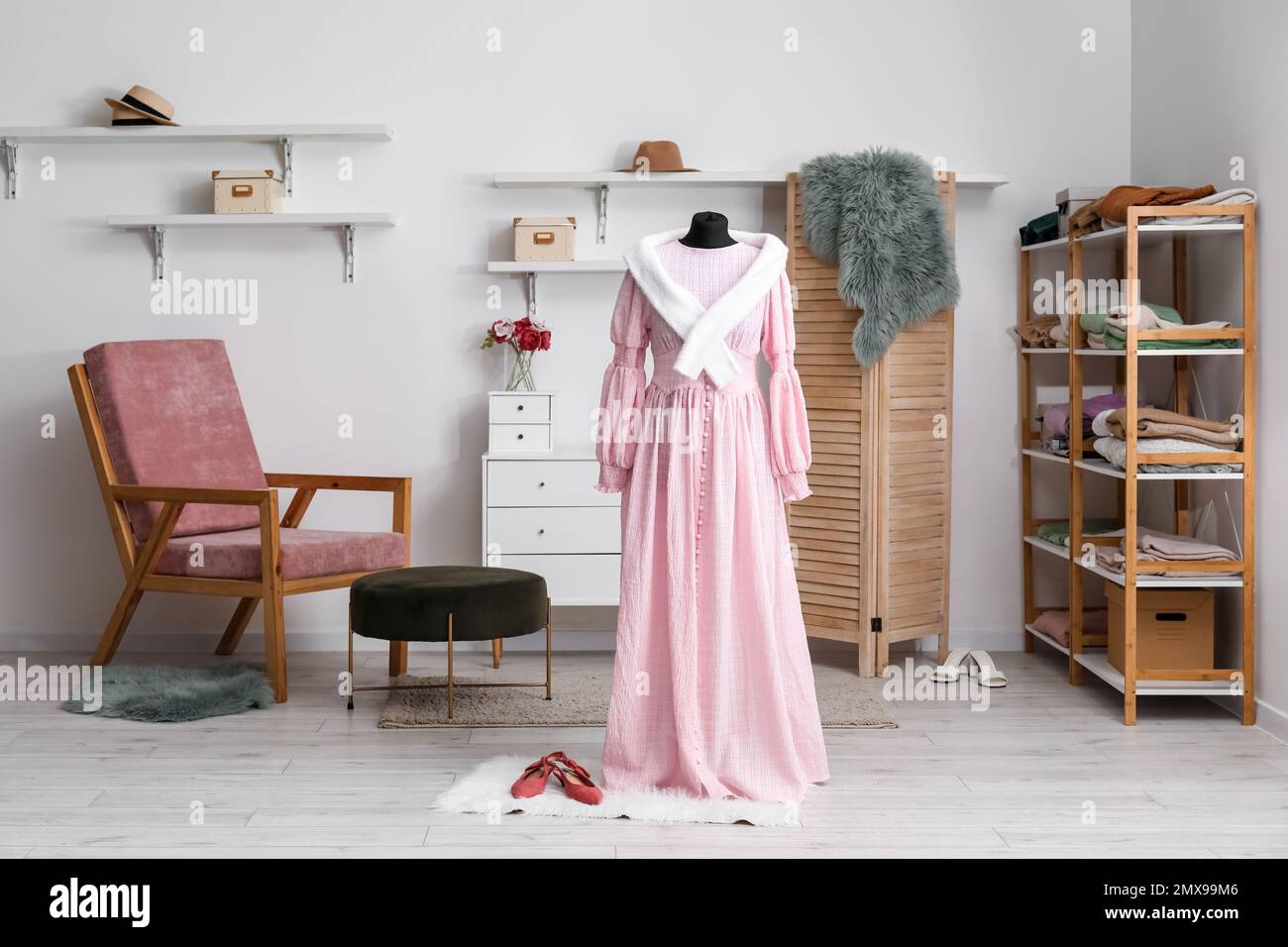 Interior of fashion designer's studio with mannequin, clothes and ...