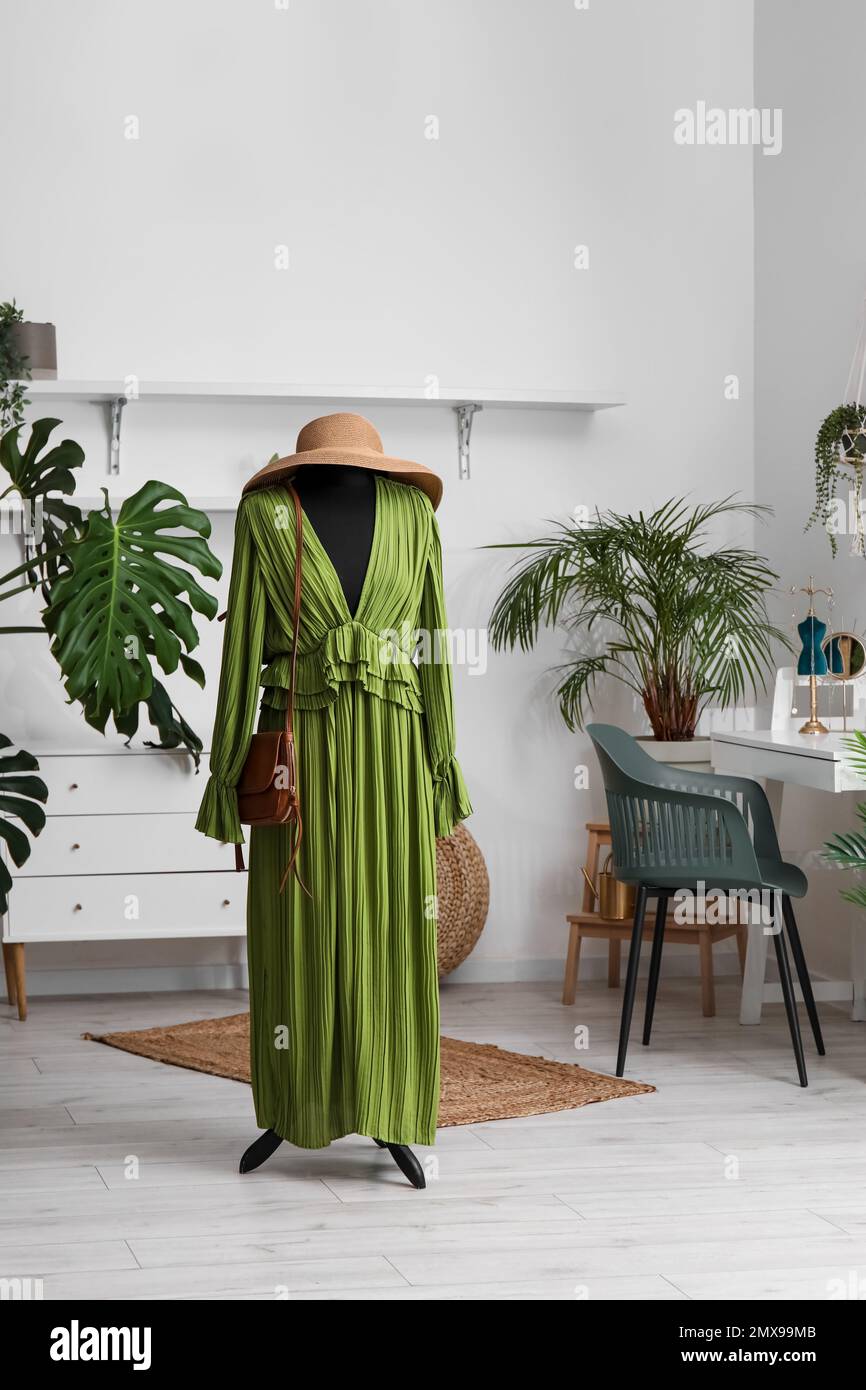 Interior of fashion designer's studio with mannequin, workplace and ...