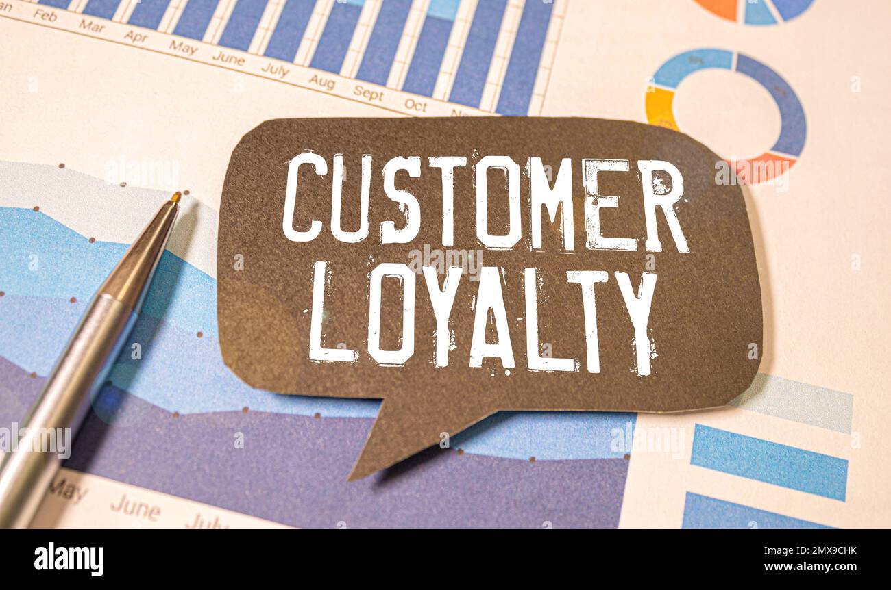 customer loyalty inscription on a notebook on an office desk, a ...