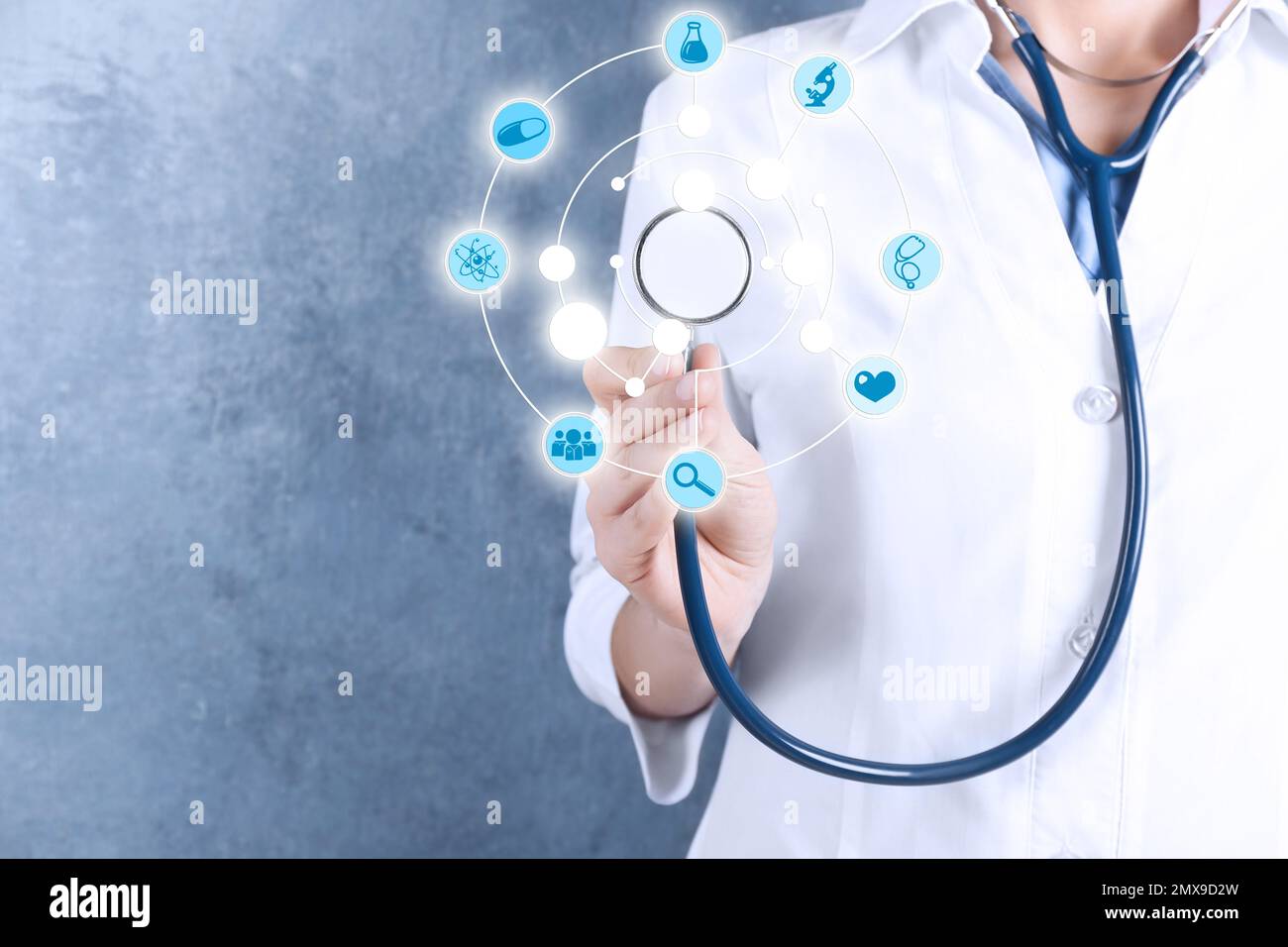 Doctor with stethoscope on blue background, closeup. Medical service ...