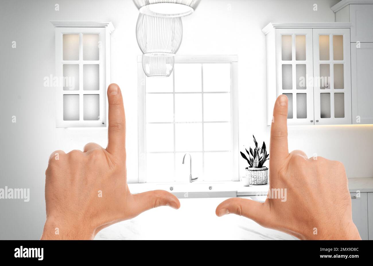 Woman showing frame gesture and making kitchen real out of drawing ...