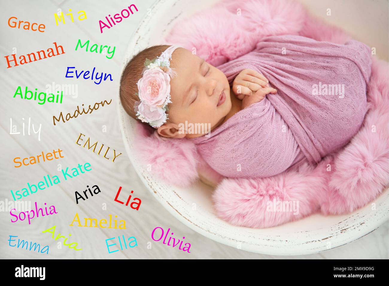 Choosing name for baby girl. Adorable newborn sleeping, view from above ...