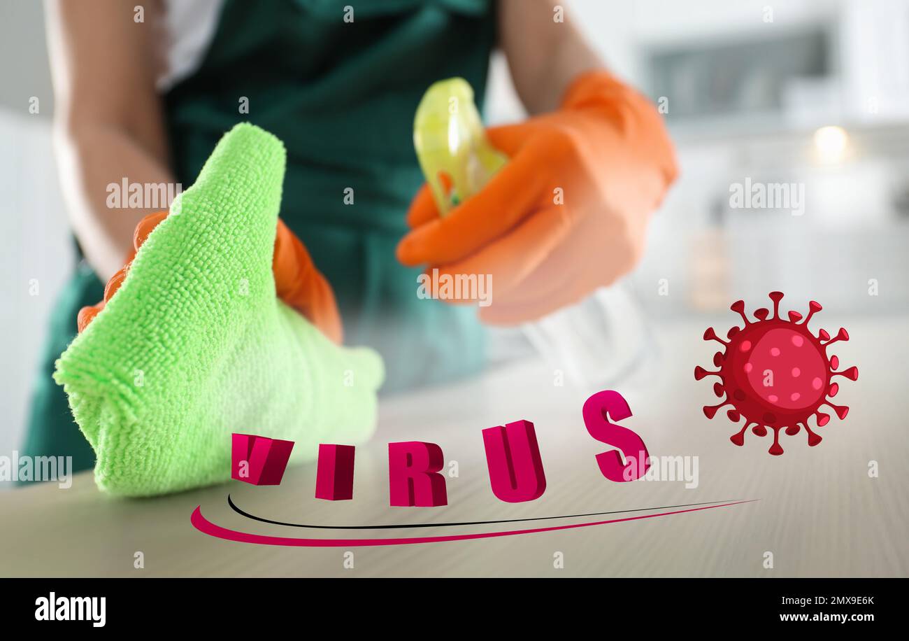 Cleaning vs viruses. Woman washing table with rag and disinfecting ...