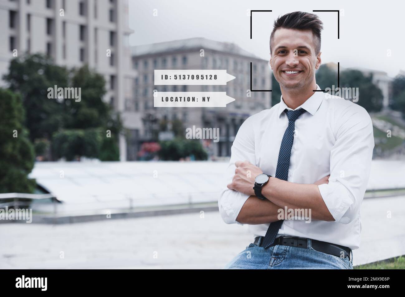 People search by facial recognition. Man outdoors with scanner frame on ...