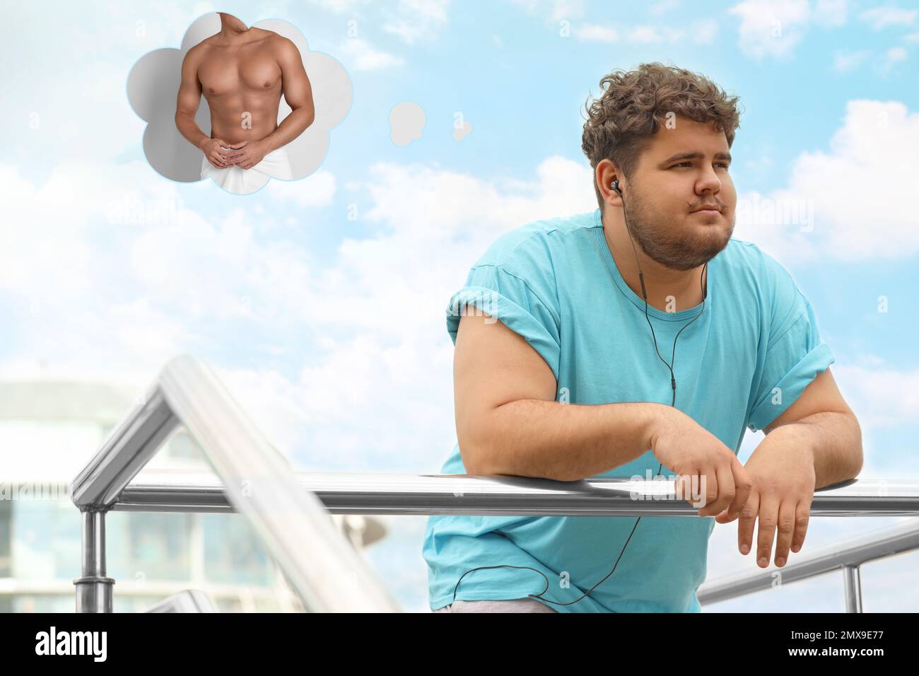 Young overweight man dreaming about muscular body outdoors Stock Photo ...