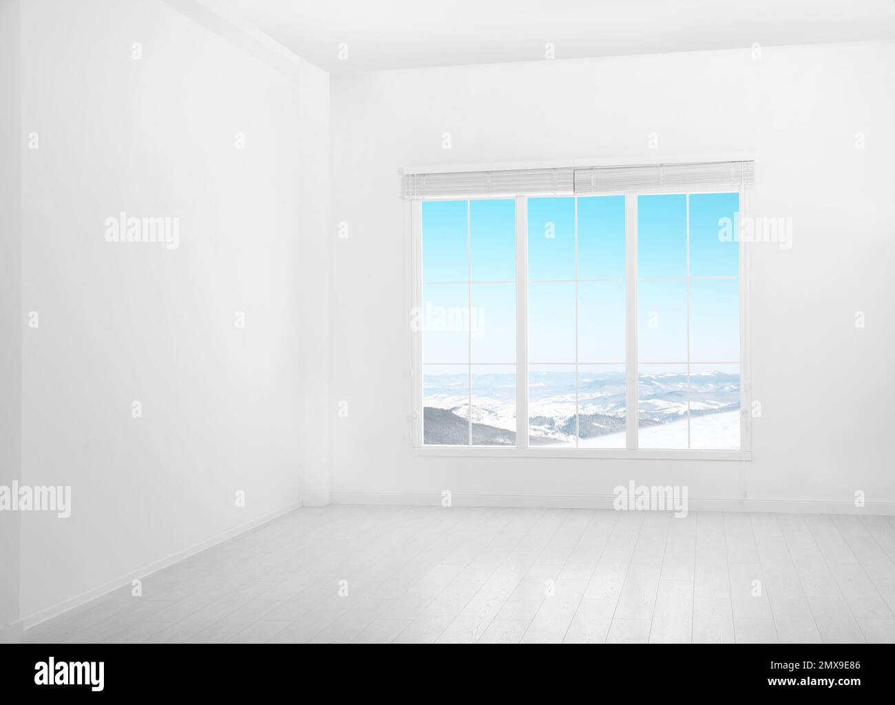 Beautiful view of snowy mountains through big window Stock Photo - Alamy