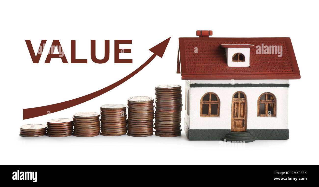 Model of house and stacked coins on white background. Growing value ...