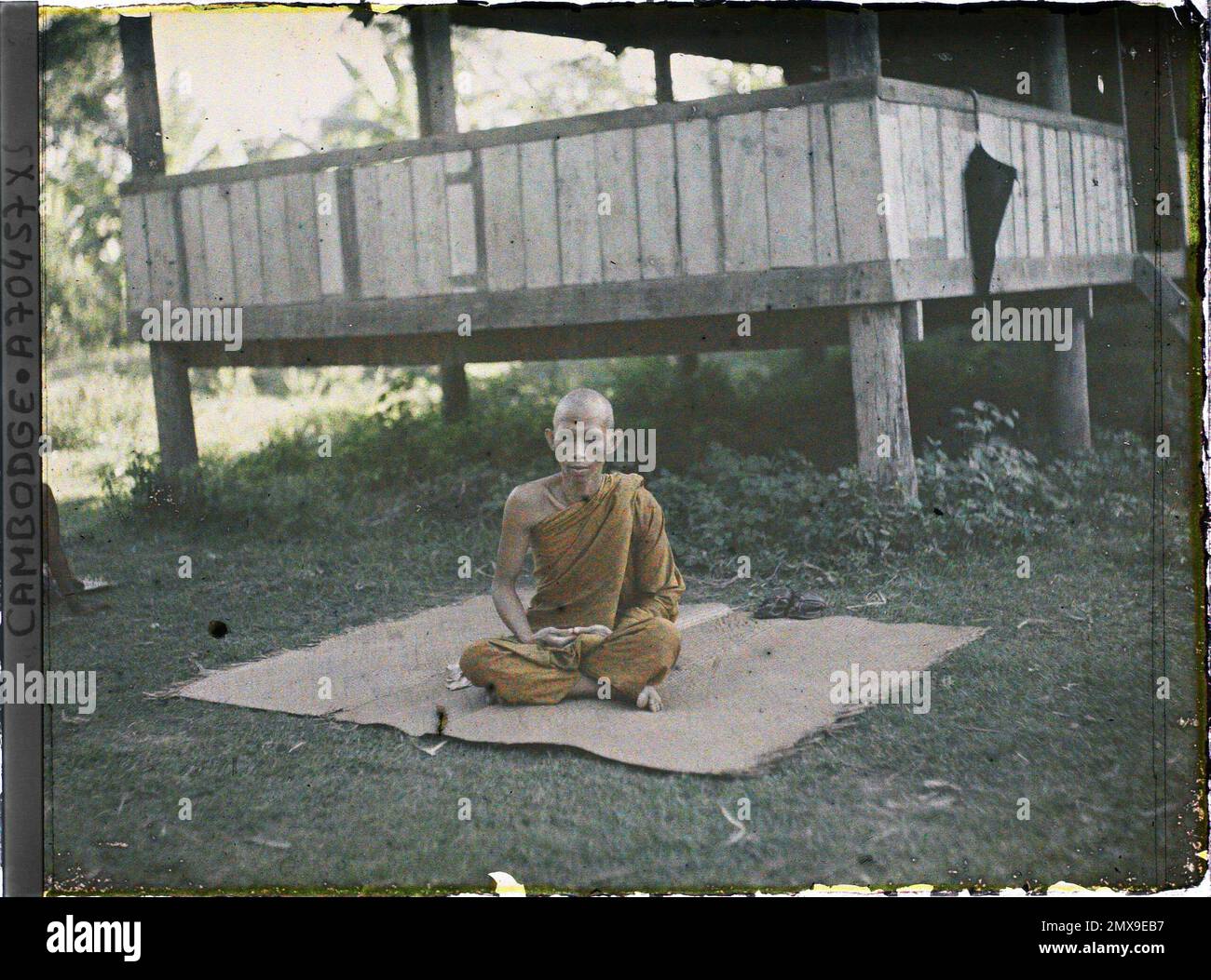 Angkor Vat (?), Cambodia, Indochina A bonze seated in meditation on a ...