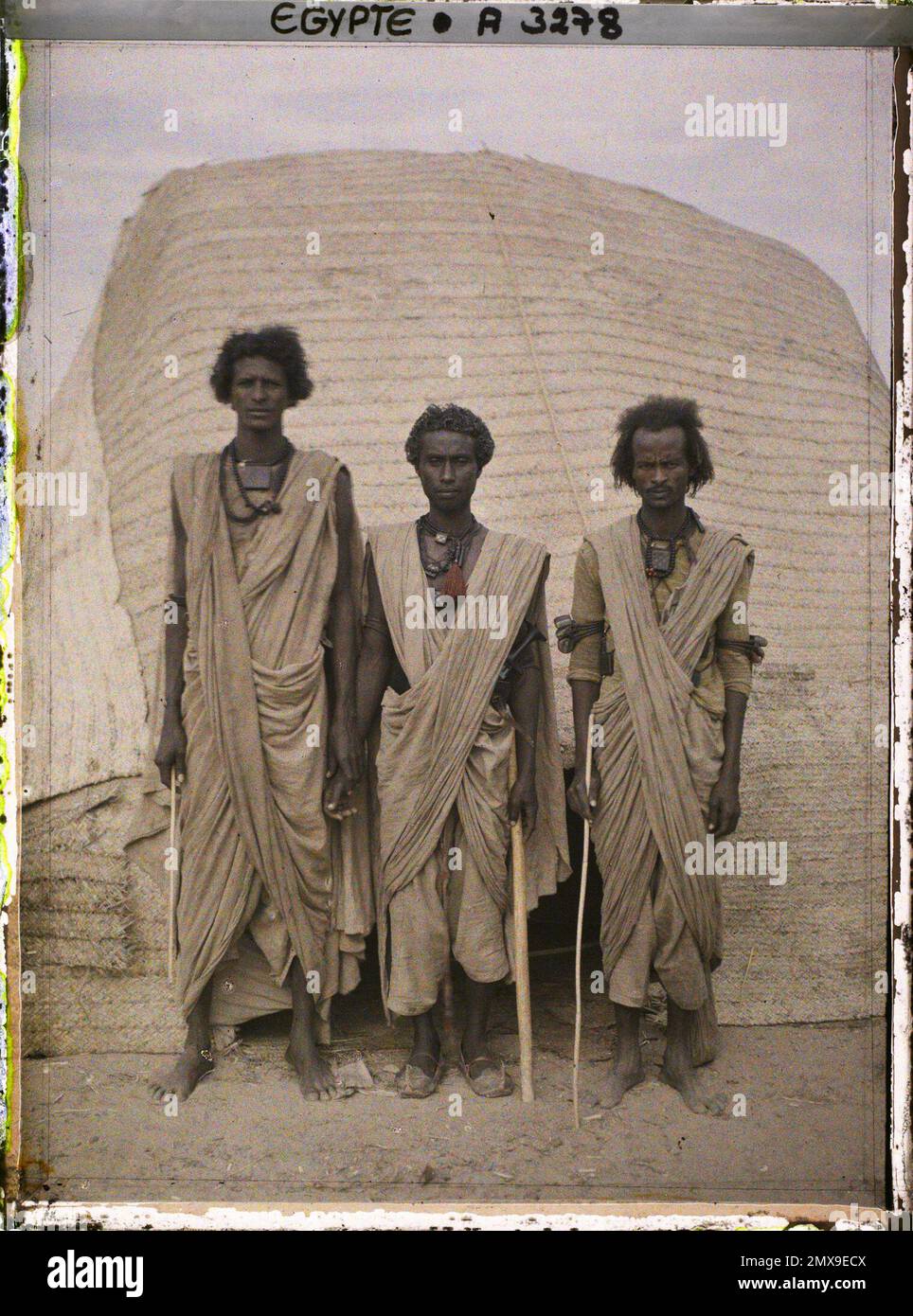 Assouan, Egypt, Africa three men bishari posing in front of a house ...