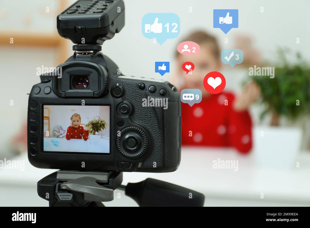 Cute little blogger recording video at home, focus on camera Stock ...