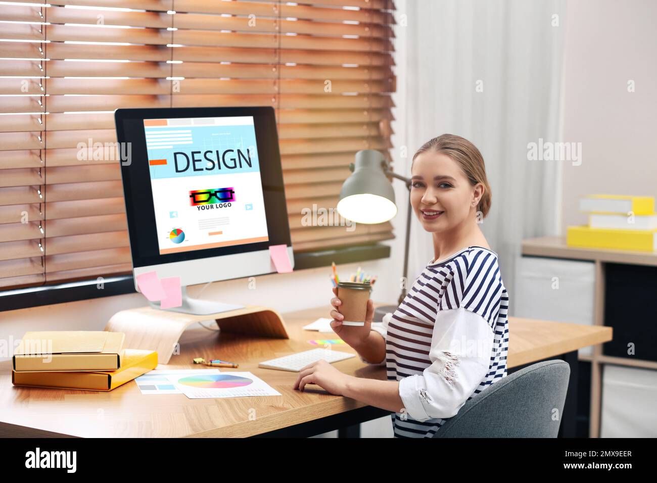 Professional female designer working hi-res stock photography and ...