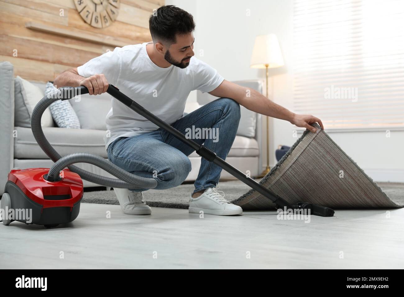 Adult male using vacuum cleaner hi-res stock photography and images - Alamy