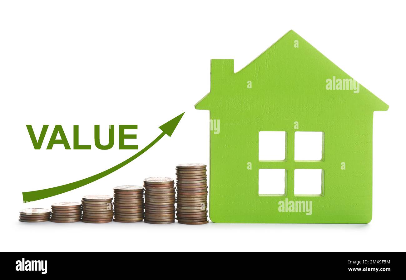 Model of house and stacked coins on white background. Growing value ...