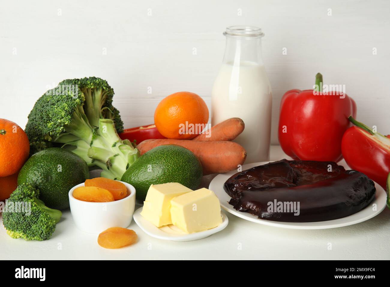 Different natural food rich in vitamin A on white table Stock Photo - Alamy