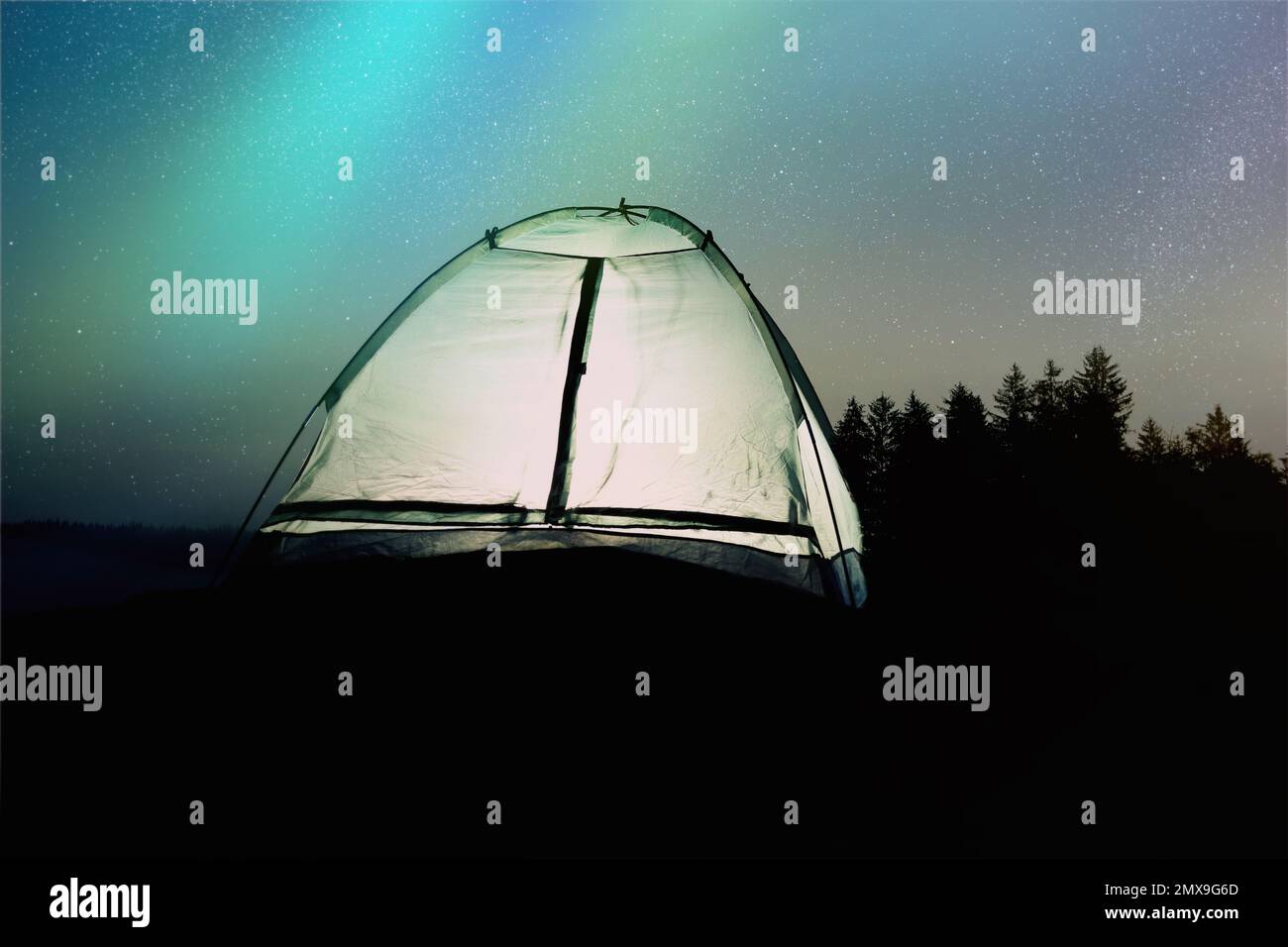 Modern camping tent glowing in twilight outdoors Stock Photo - Alamy