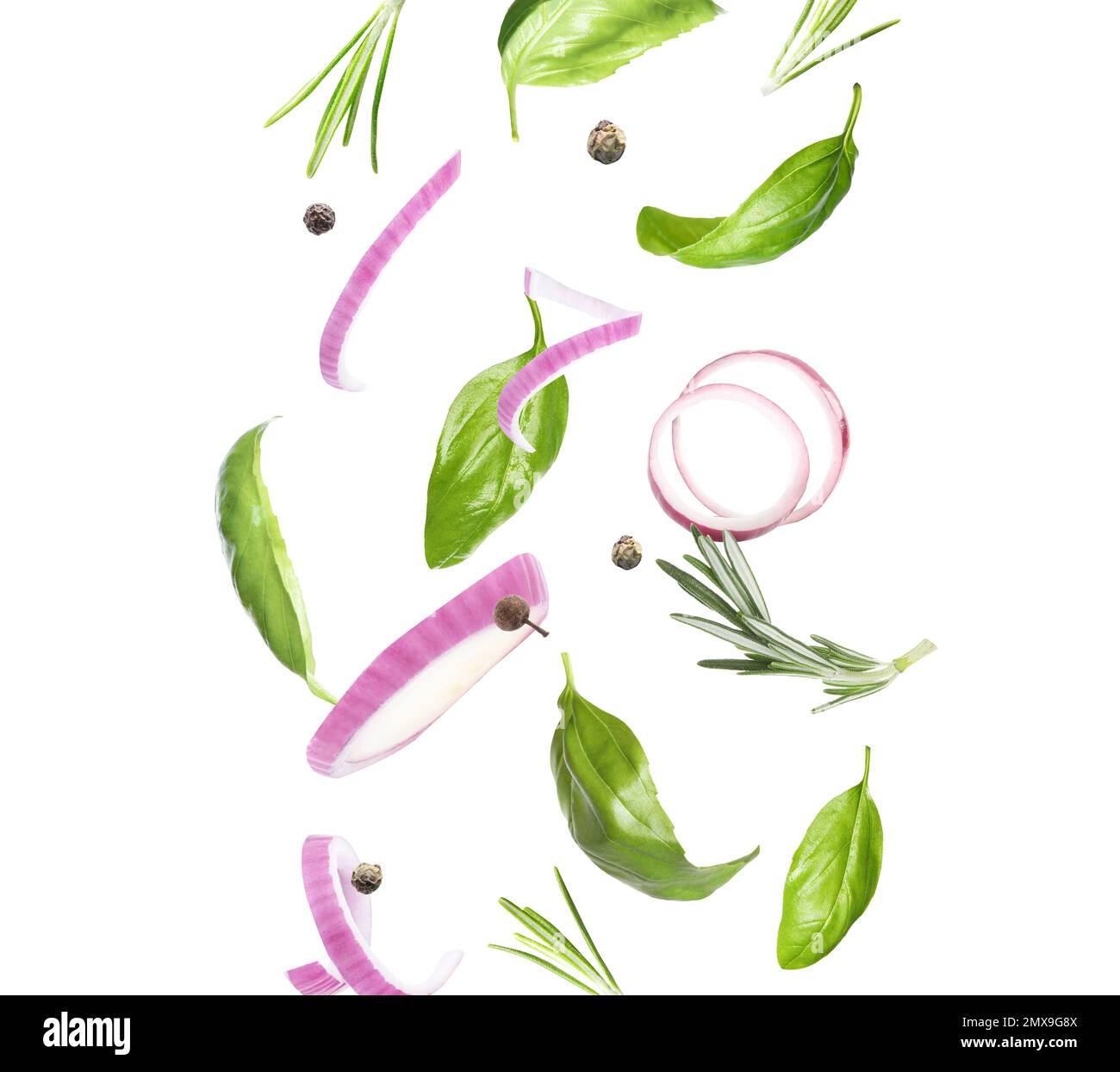 Basil leaves and other ingredients falling on white background Stock ...