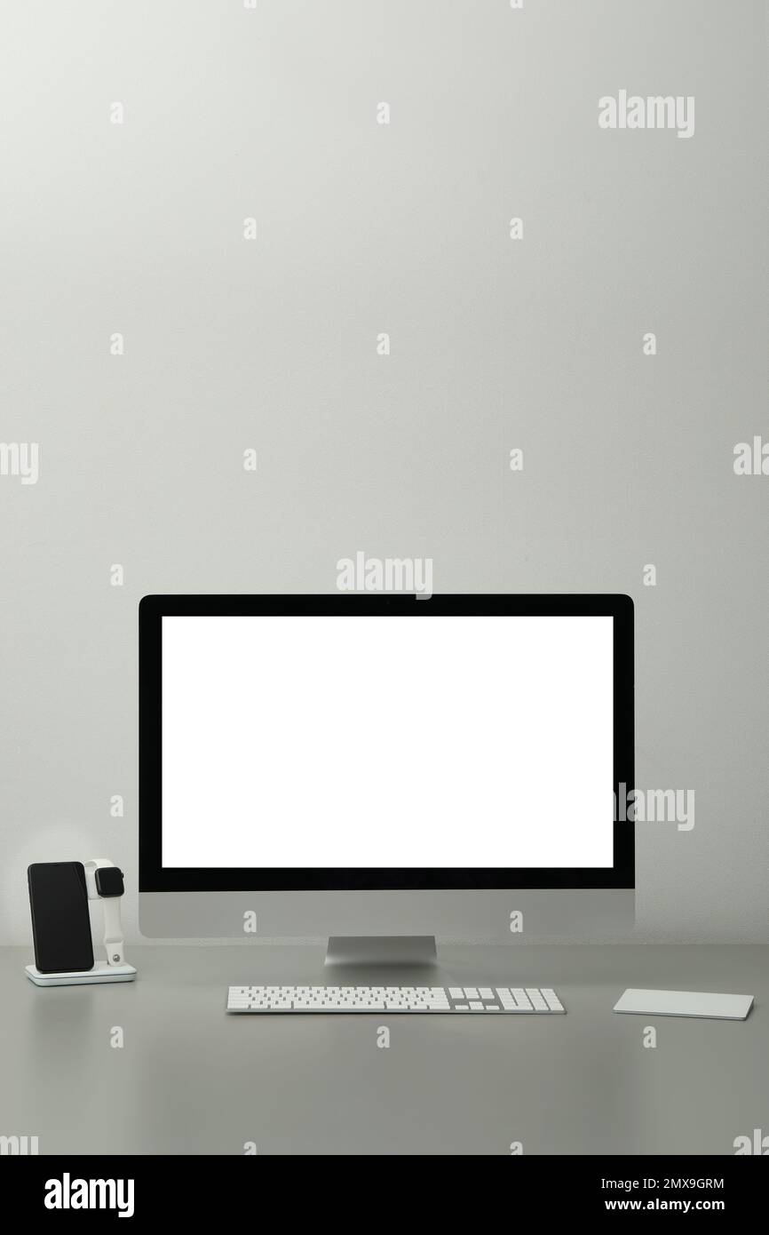 Modern workplace with computer and charging devices. Interior design ...