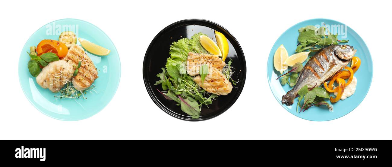 Set with delicious freshly cooked fish dishes on white background, top ...