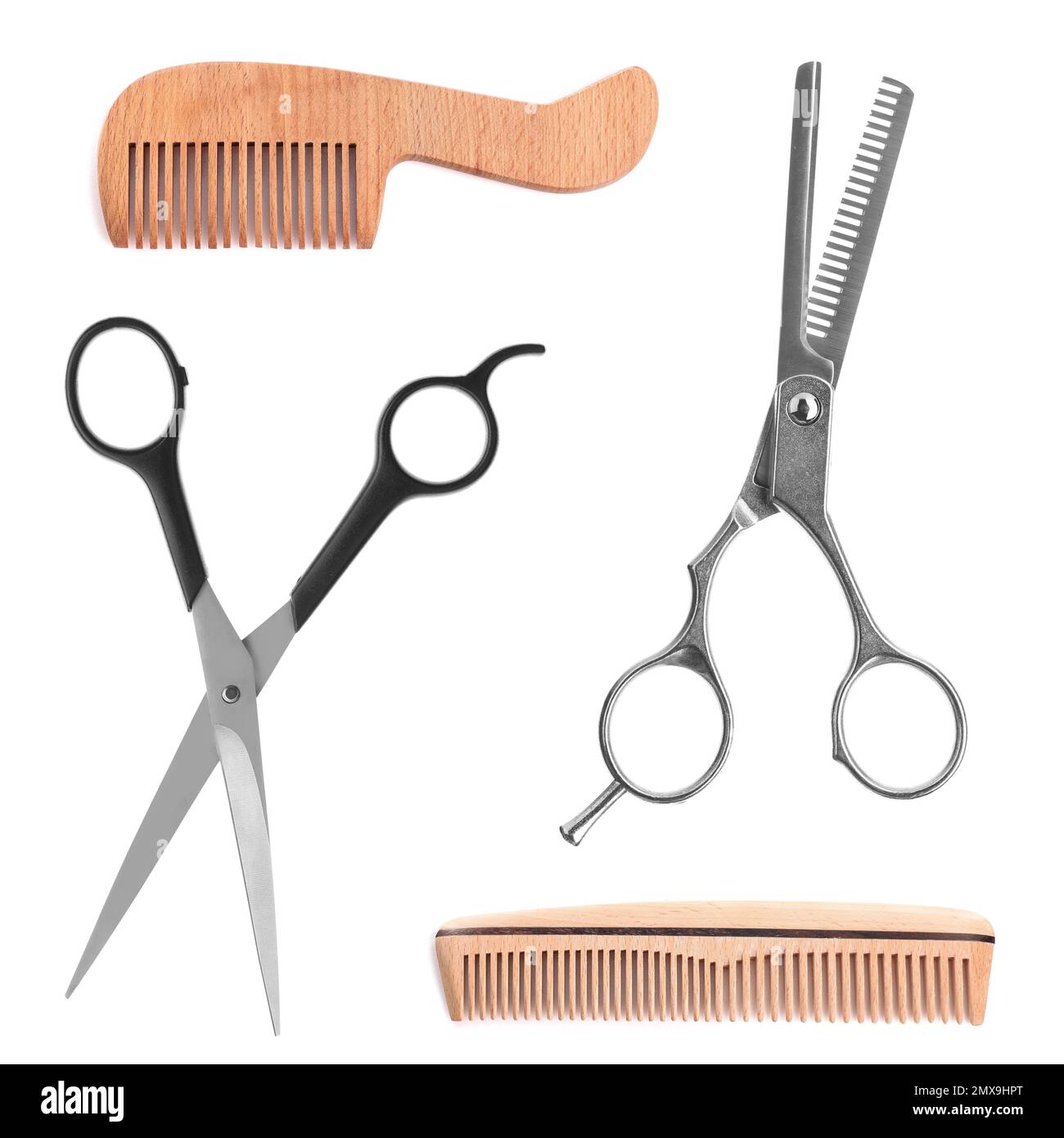 Set of different professional hairdresser scissors and wooden combs on ...
