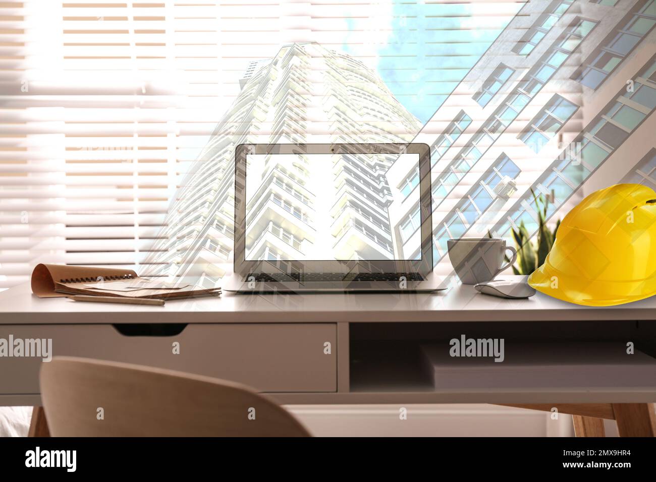 Engineer workplace with laptop and modern building. Double exposure ...