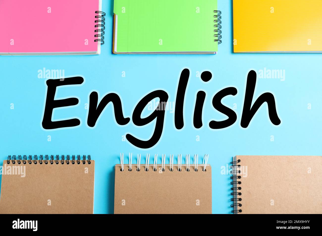 Flat lay composition with notebooks on light blue background. Learning ...