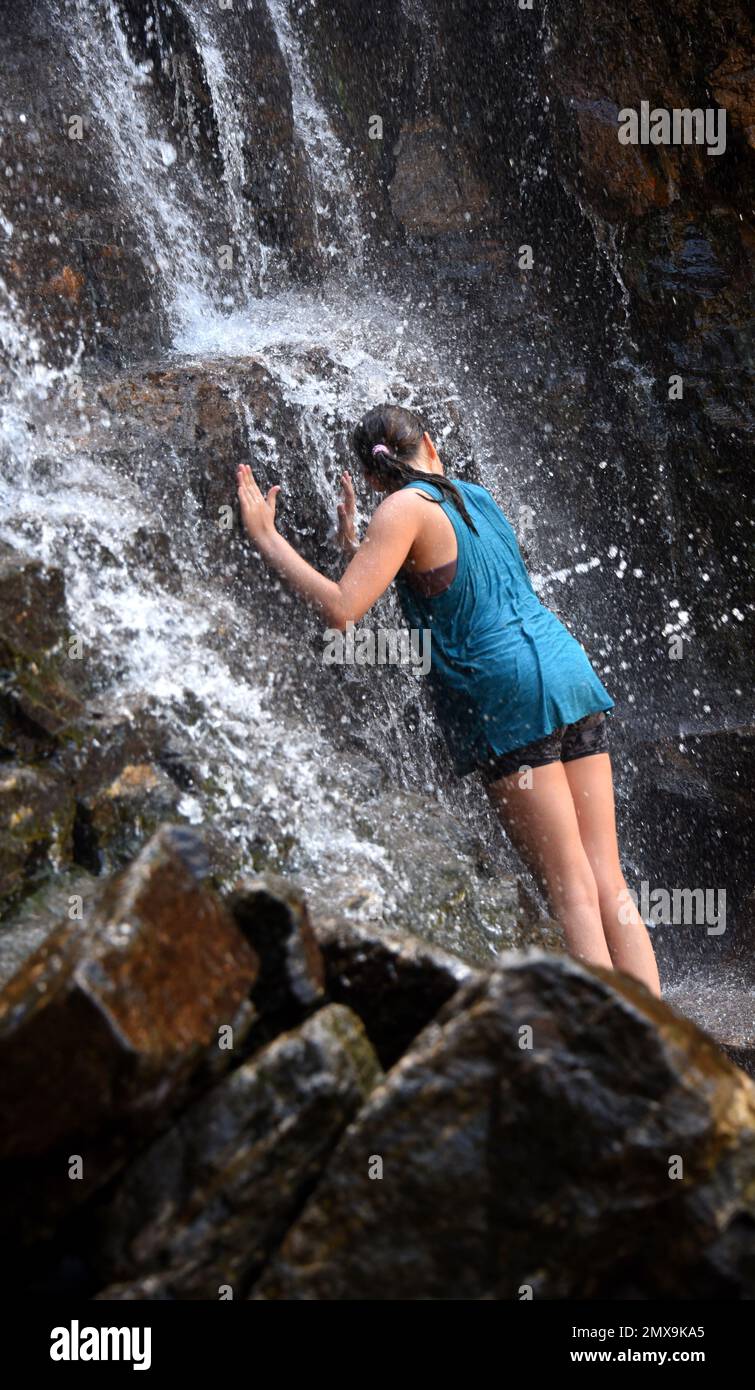 Girl playing in waterfall hi-res stock photography and images - Alamy
