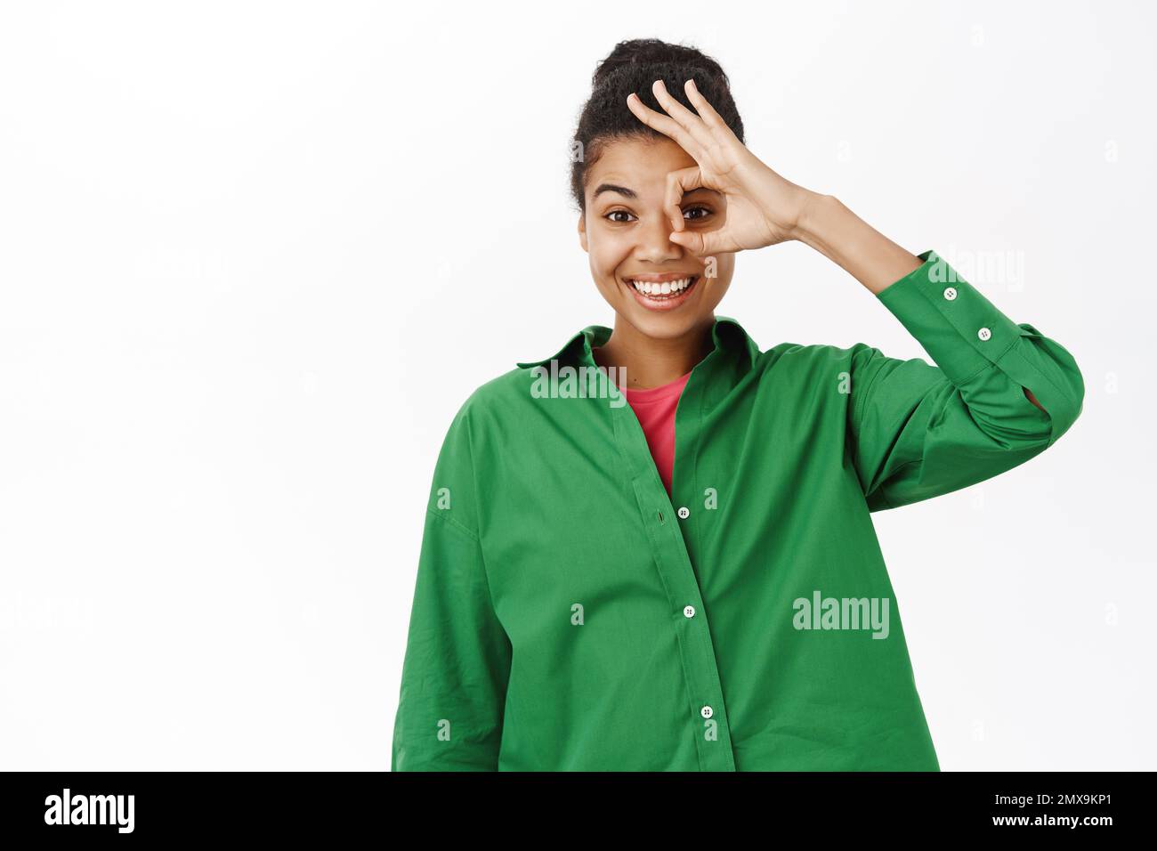 Portrait of positive young african american woman shows okay, zero ...