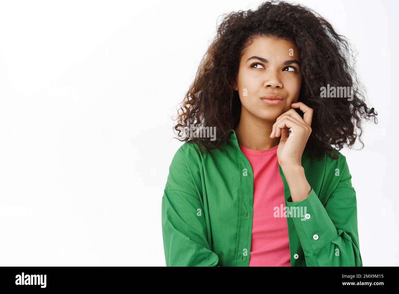 Portrait of girl with thoughtful face, thinking of something, pondering ...