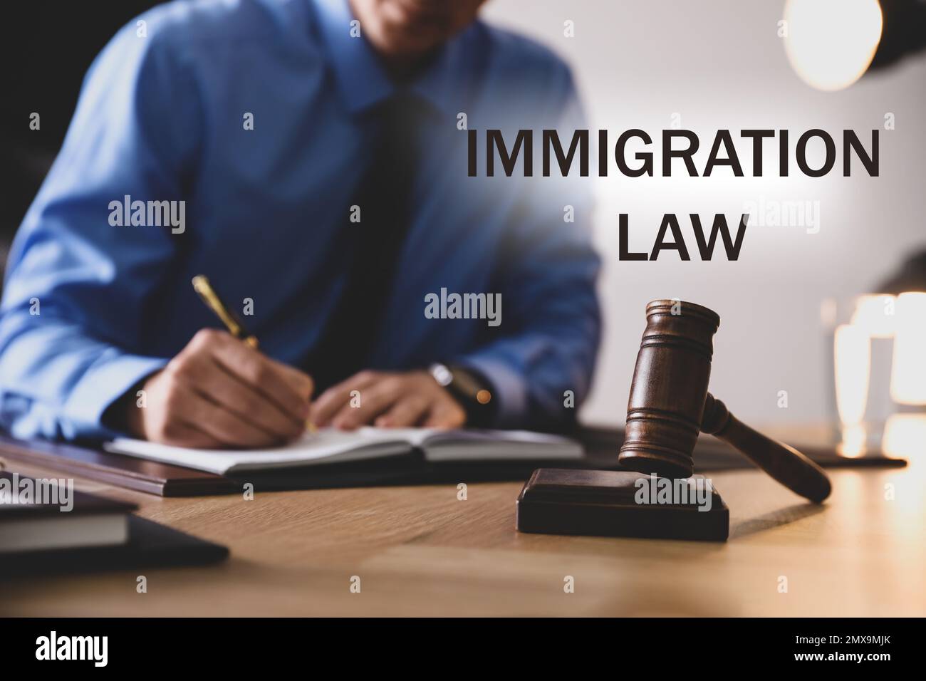 Man working at table in office, focus on gavel. Immigration law Stock ...