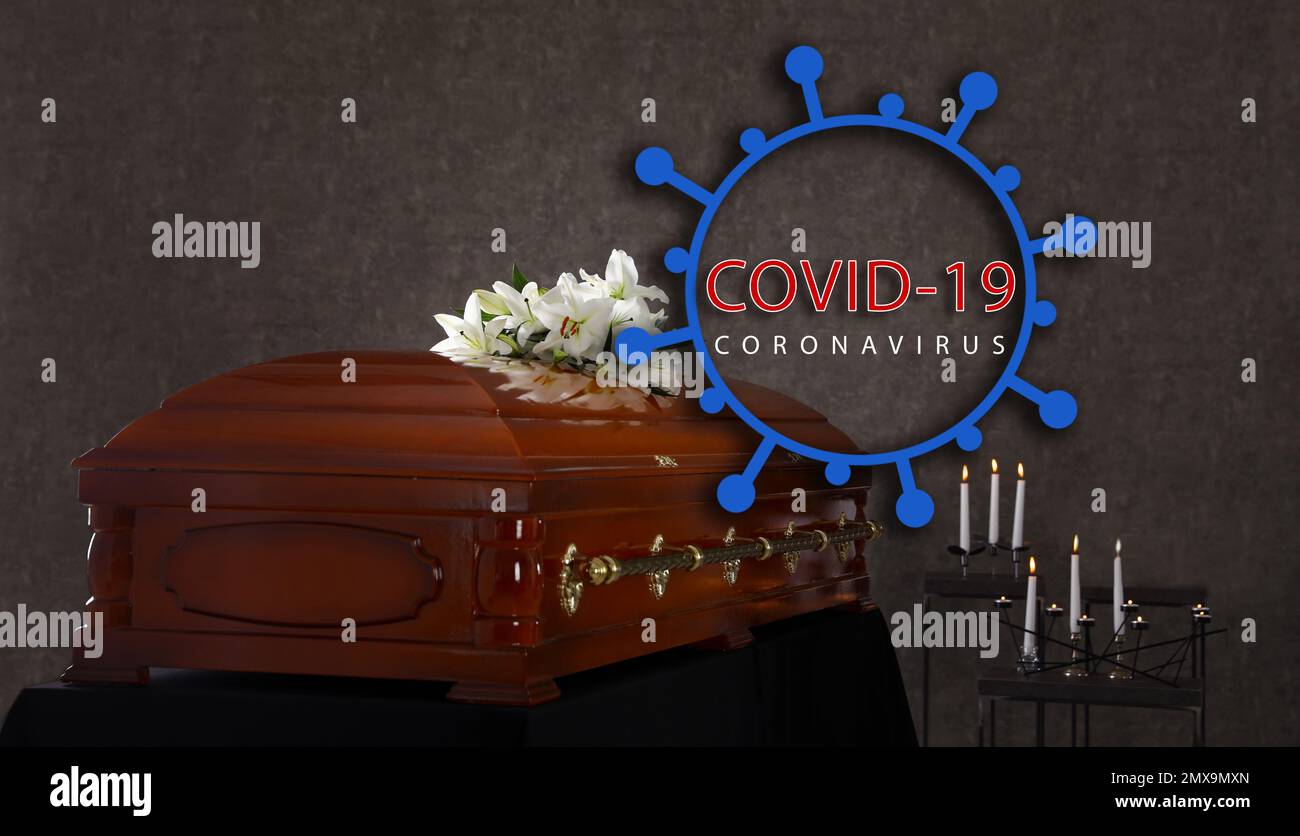 Coronavirus deaths. Funeral casket with white lilies at grey wall Stock ...