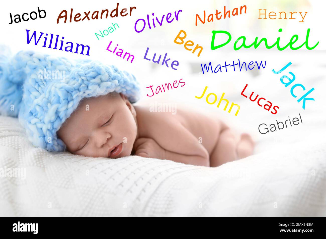 Choosing name for baby boy. Adorable newborn sleeping on bed Stock ...