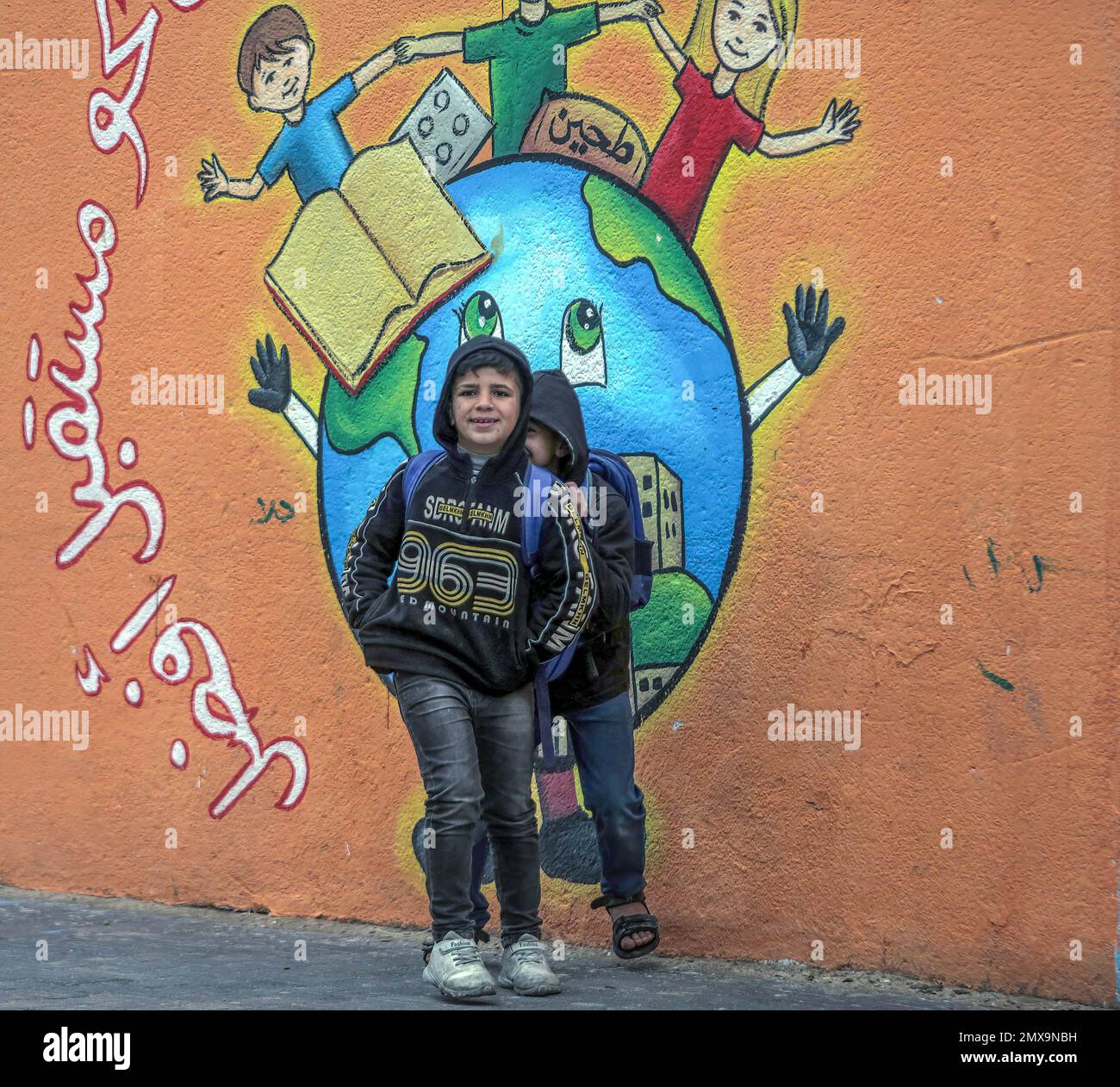 Palestinian students outside school as they return home during ...