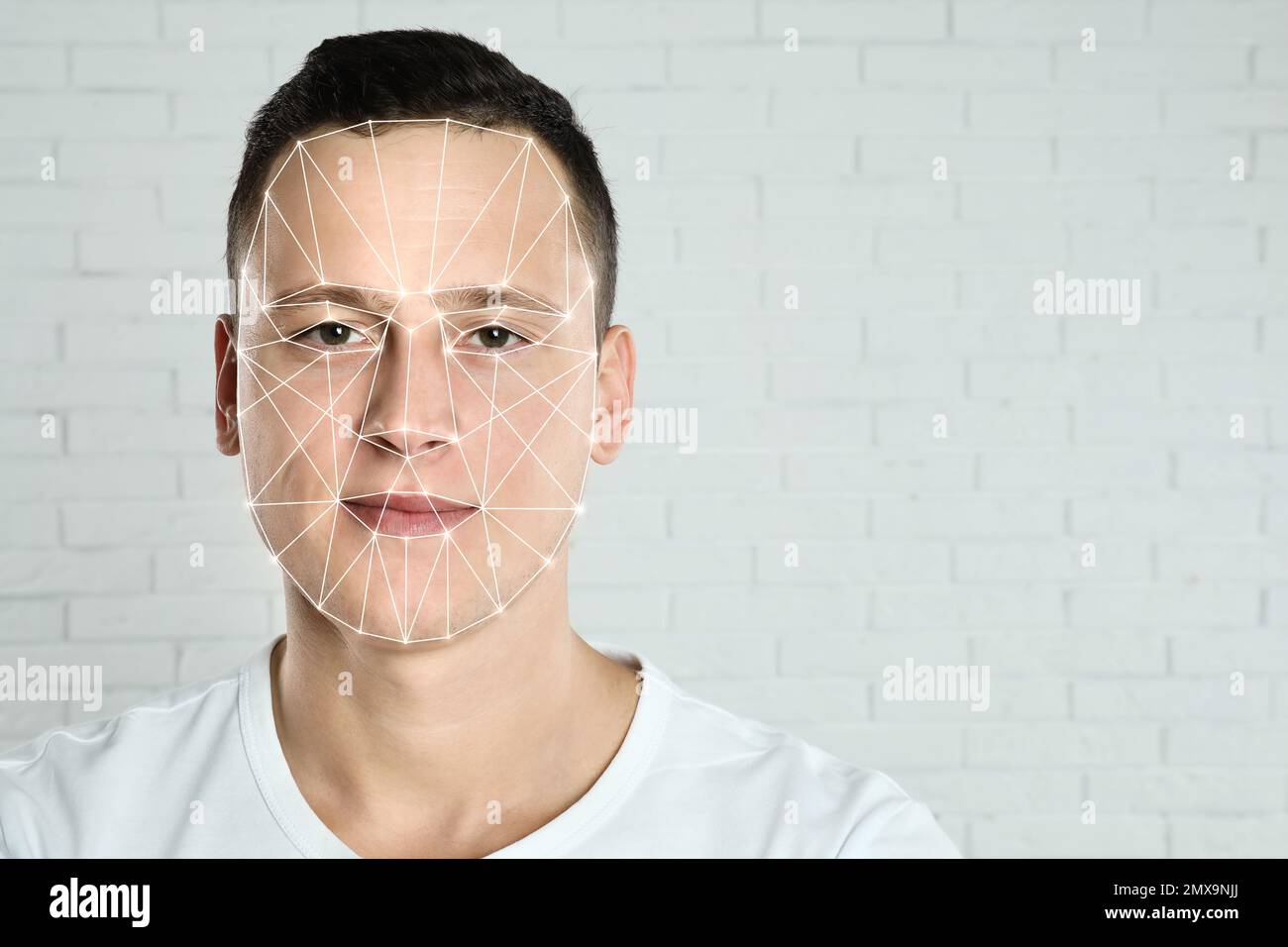 Facial recognition system. Young man with biometric identification ...