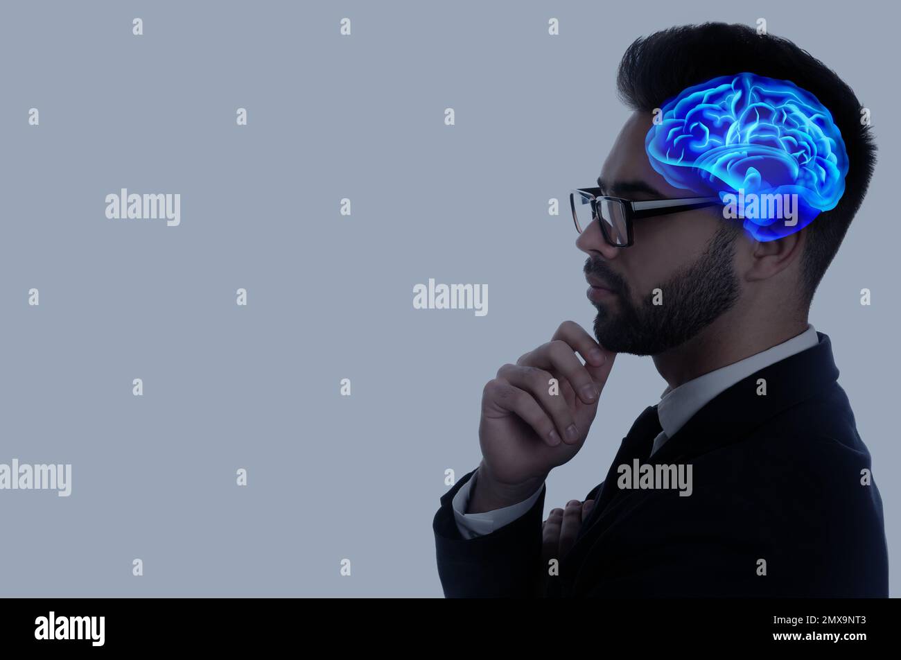 Thinking concept, space for text. Young man and illustrated brain on ...