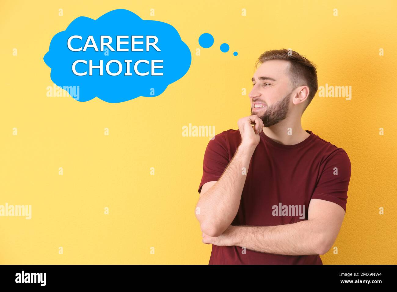 Man thinking about career choice on yellow background Stock Photo - Alamy