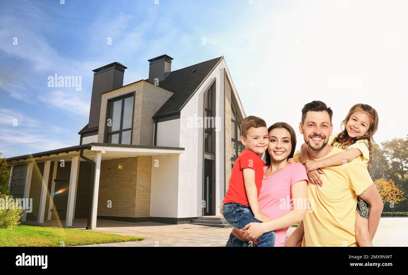 Happy family smiling near their new house Stock Photo - Alamy Happy family smiling near their new house Stock Photo - Alamy