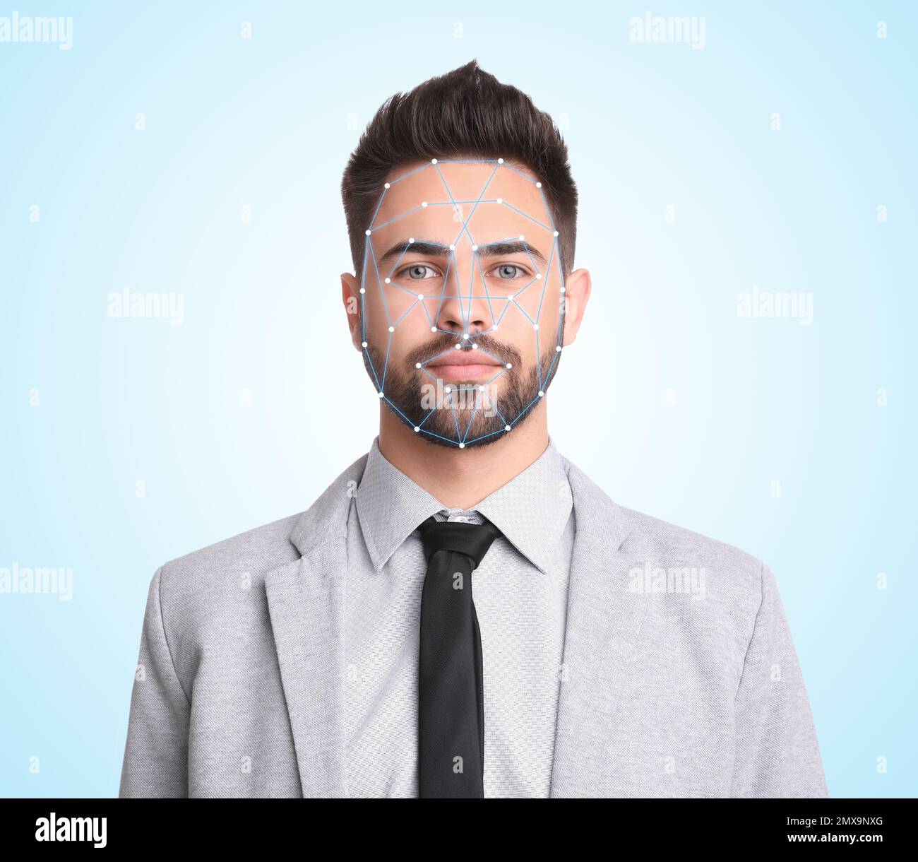 Facial recognition system. Young man with biometric identification ...