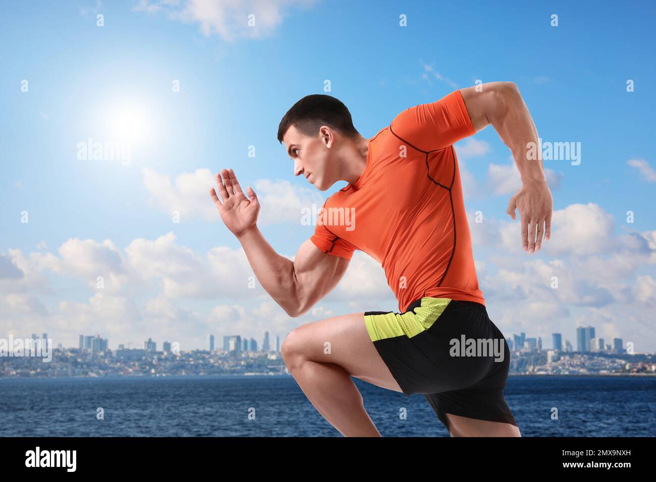Young sportsman running beach man hi-res stock photography and images ...