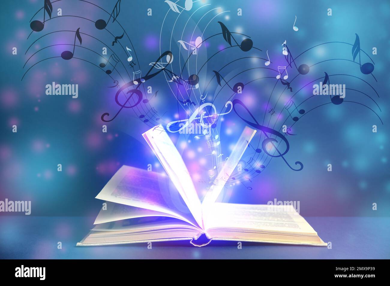 Symphony shining with musical notes from open book on color background ...