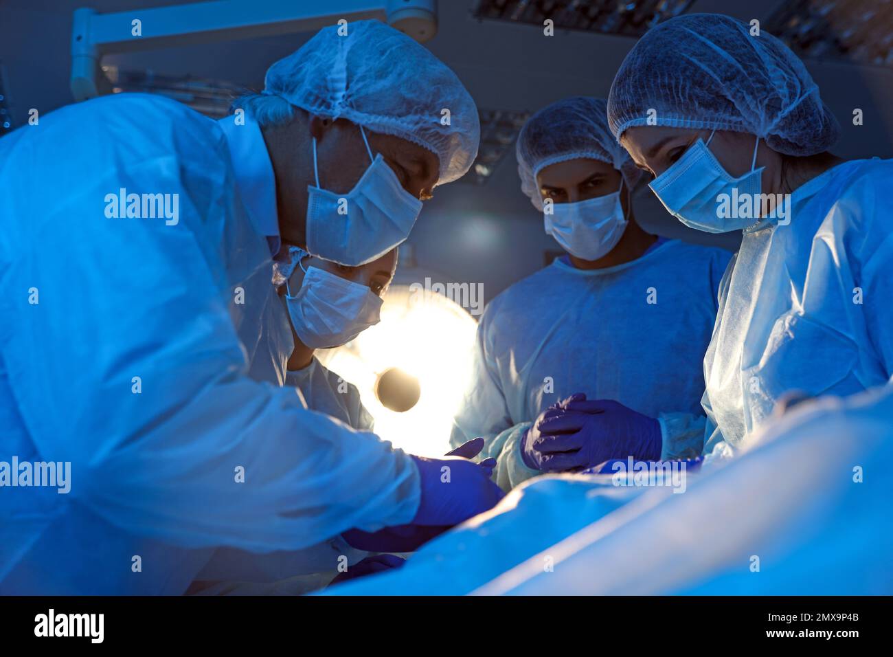 Team of professional doctors performing operation in surgery room Stock ...