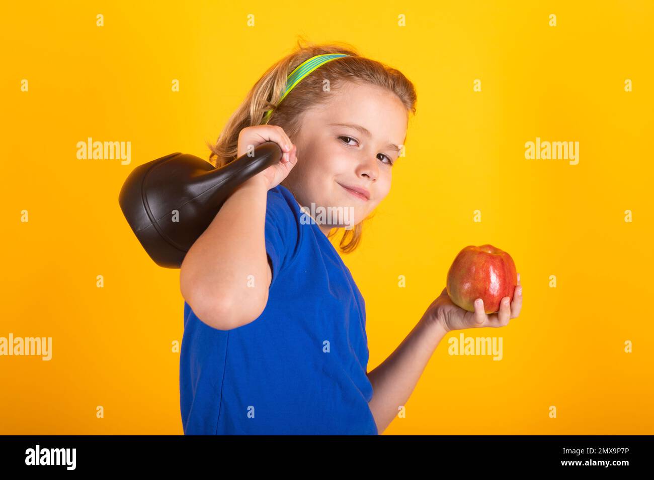 Child workout. Kid sport. Child exercising with kettlebell dumbbells ...