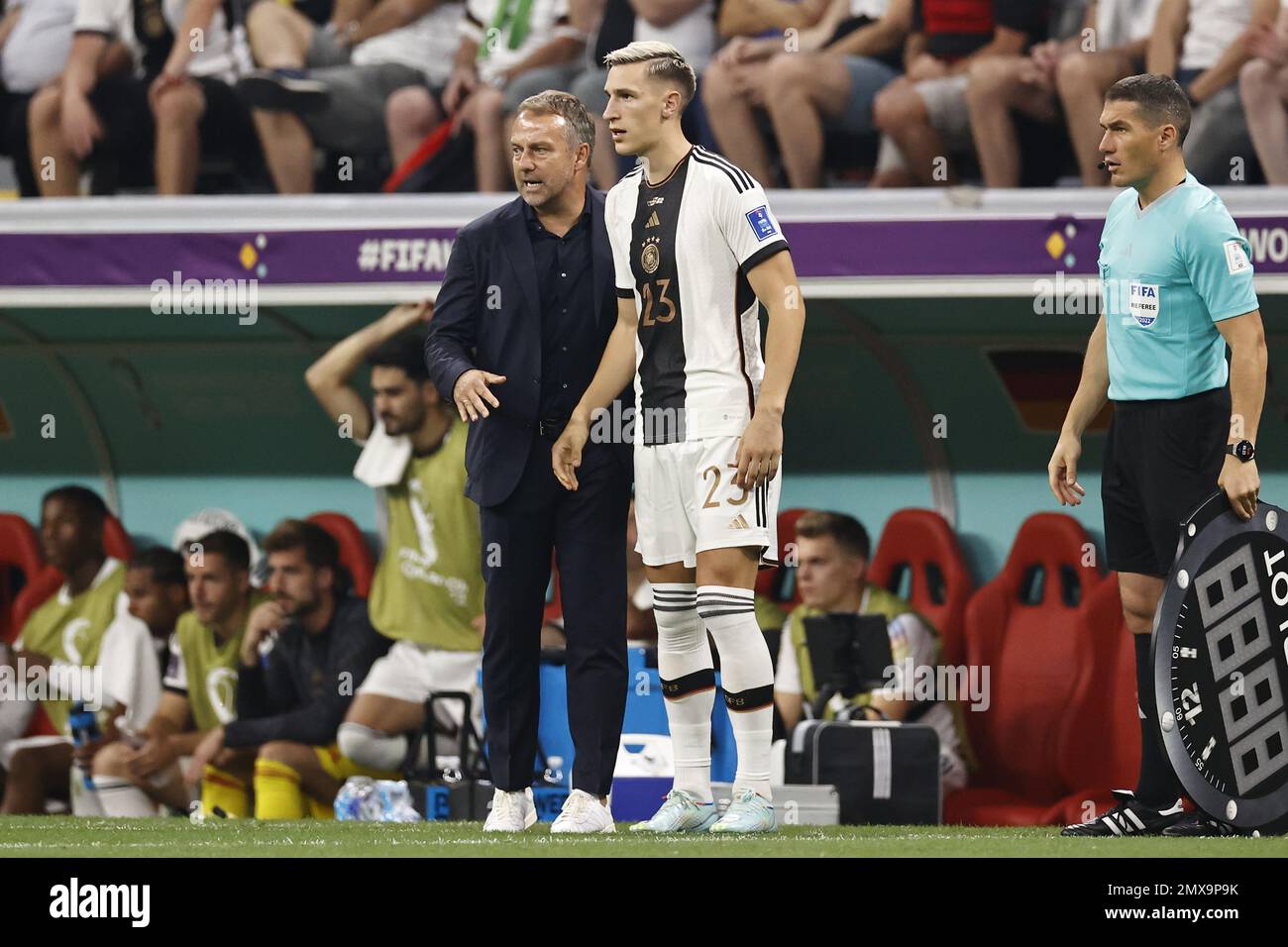 AL KHOR - (LR) Germany coach Hansi Flick, Nico Schlotterbeck of Germany ...