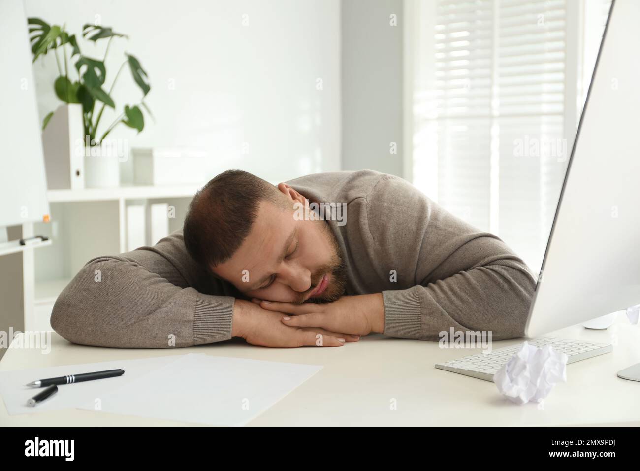Lazy overweight office employee sleeping at workplace Stock Photo - Alamy