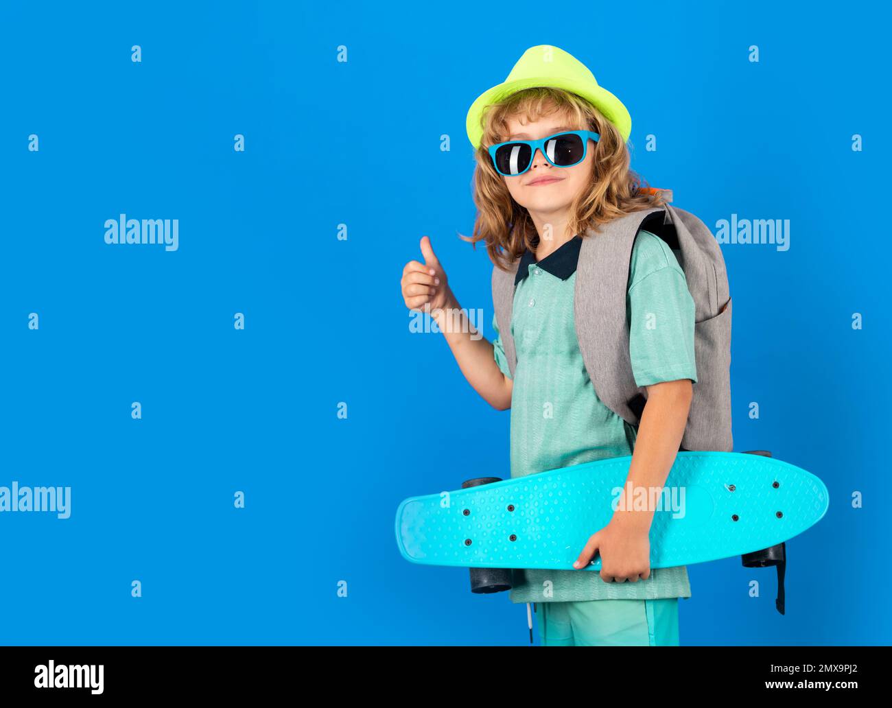 Childhood. Cute child with skateboard on color isoalted background ...