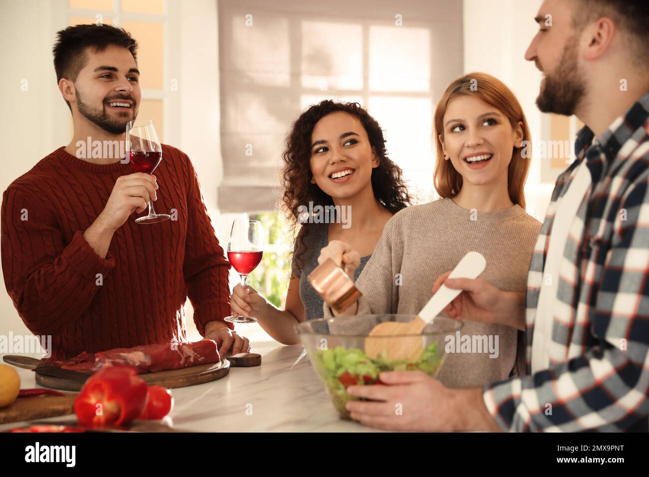 Happy people cooking food together in kitchen Stock Photo - Alamy